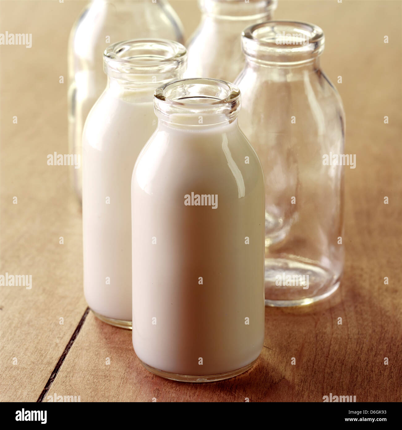 Full and Empty Milk Bottles Stock Photo - Alamy