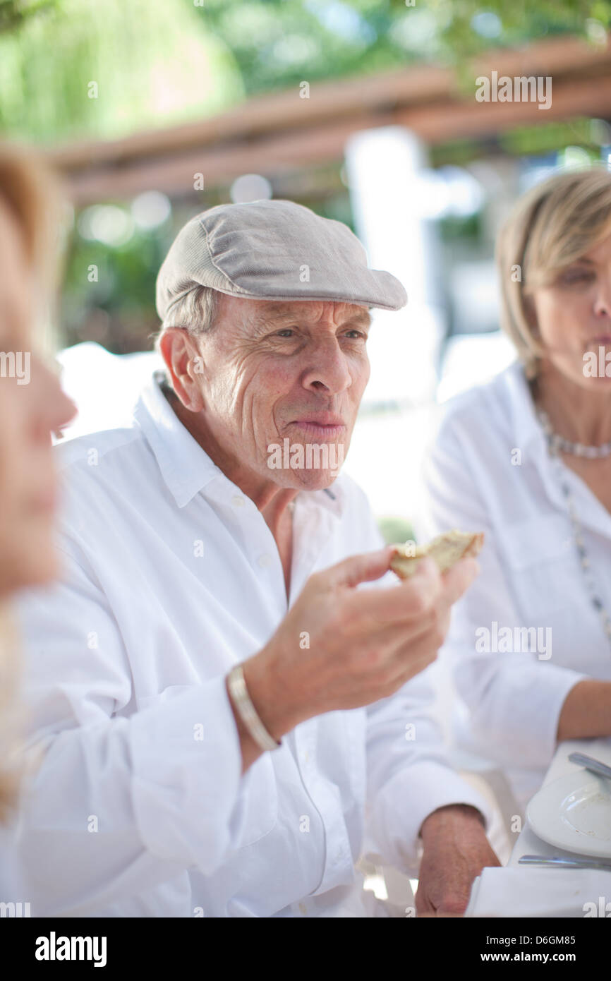 Older friends eating together outdoors Stock Photo - Alamy