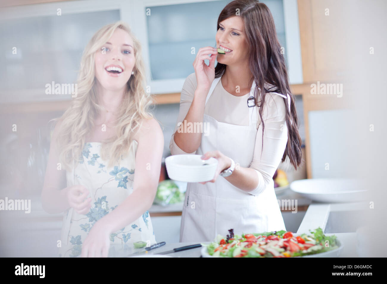 Women cooking together in kitchen Stock Photo - Alamy