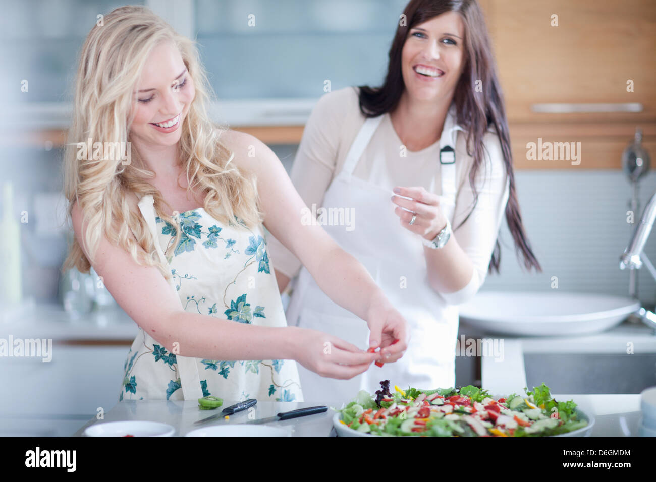 Women cooking together in kitchen Stock Photo - Alamy