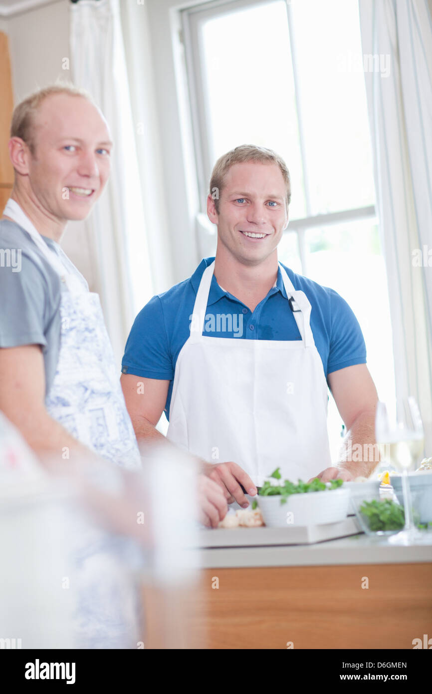 Men cooking together in kitchen Stock Photo - Alamy