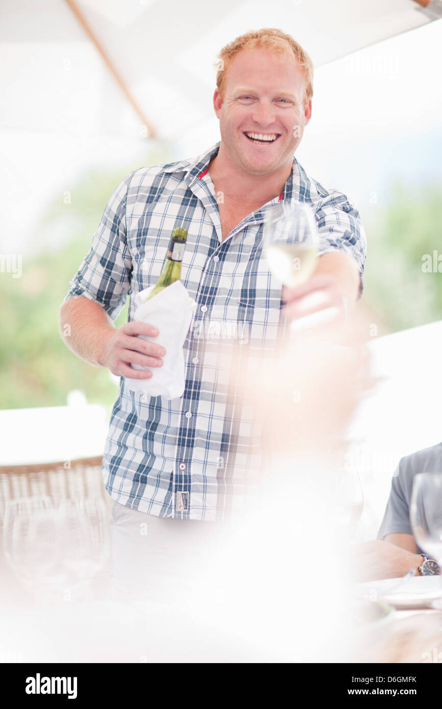 Man setting table outdoors Stock Photo - Alamy