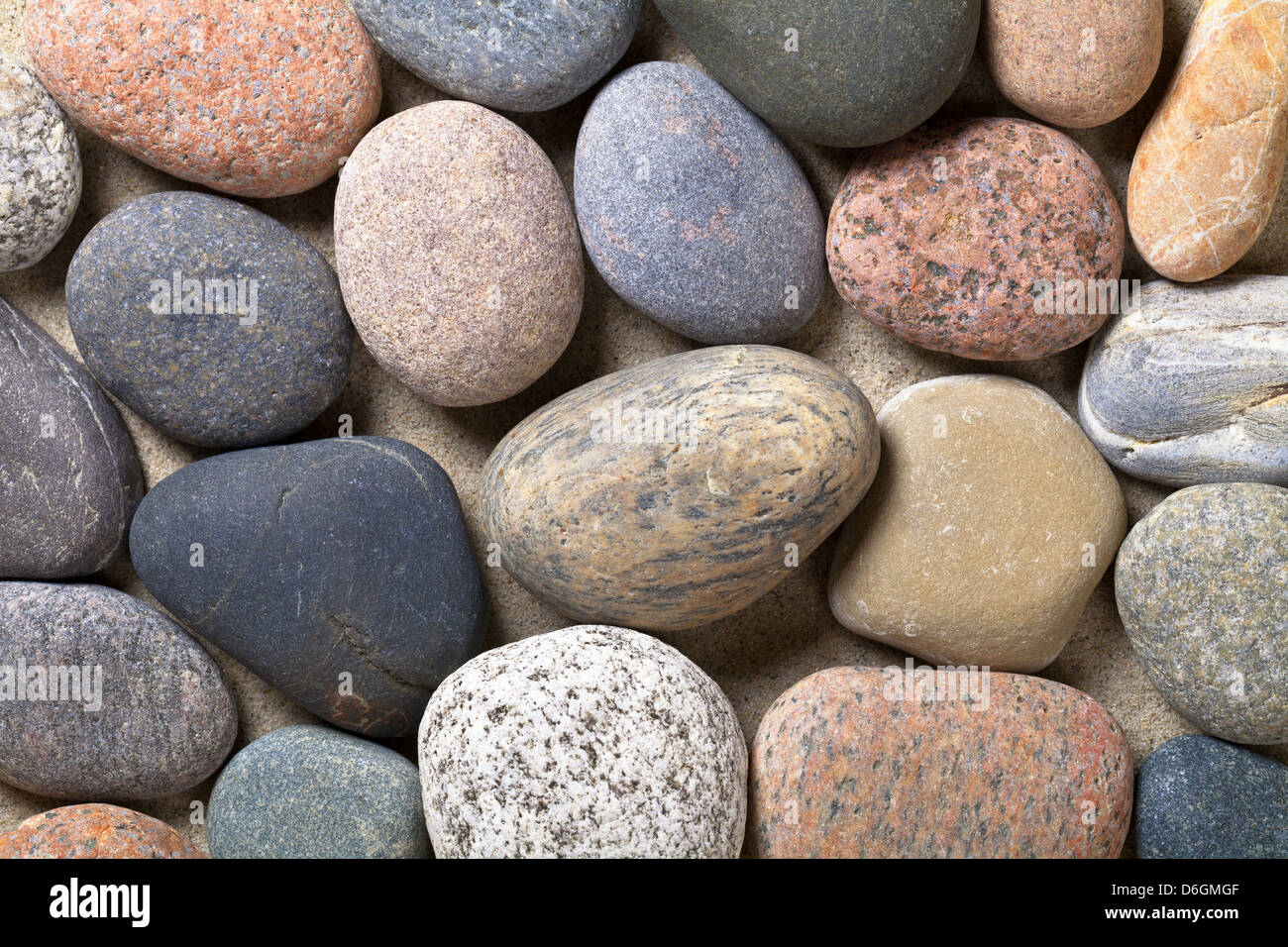 Pebble stones on sand for background. Macro shot. Top view Stock Photo ...