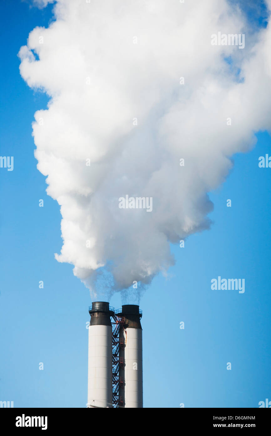 Smoke billowing from industrial plant Stock Photo - Alamy