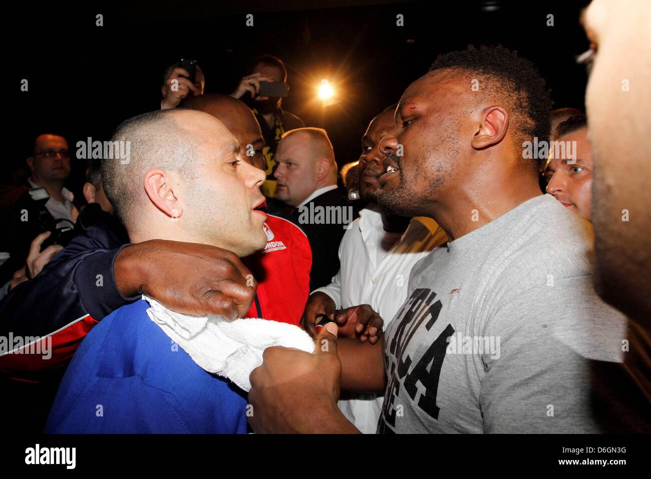 British boxer Dereck Chisora (R) argues with Haye manager Adam Booth ...