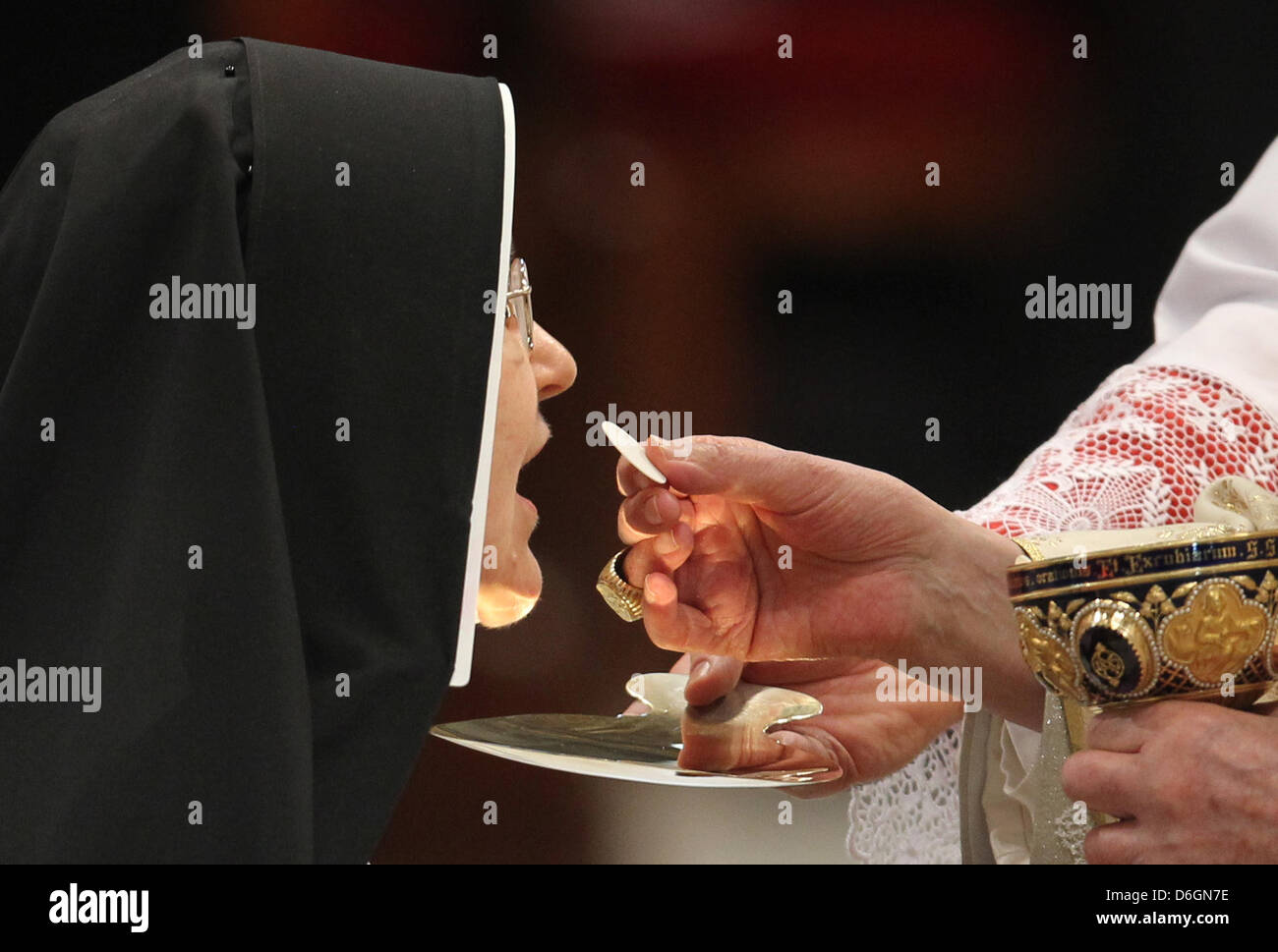 Pope Benedit XVI. gives the Holy Communion to a nun in St. Peter's ...