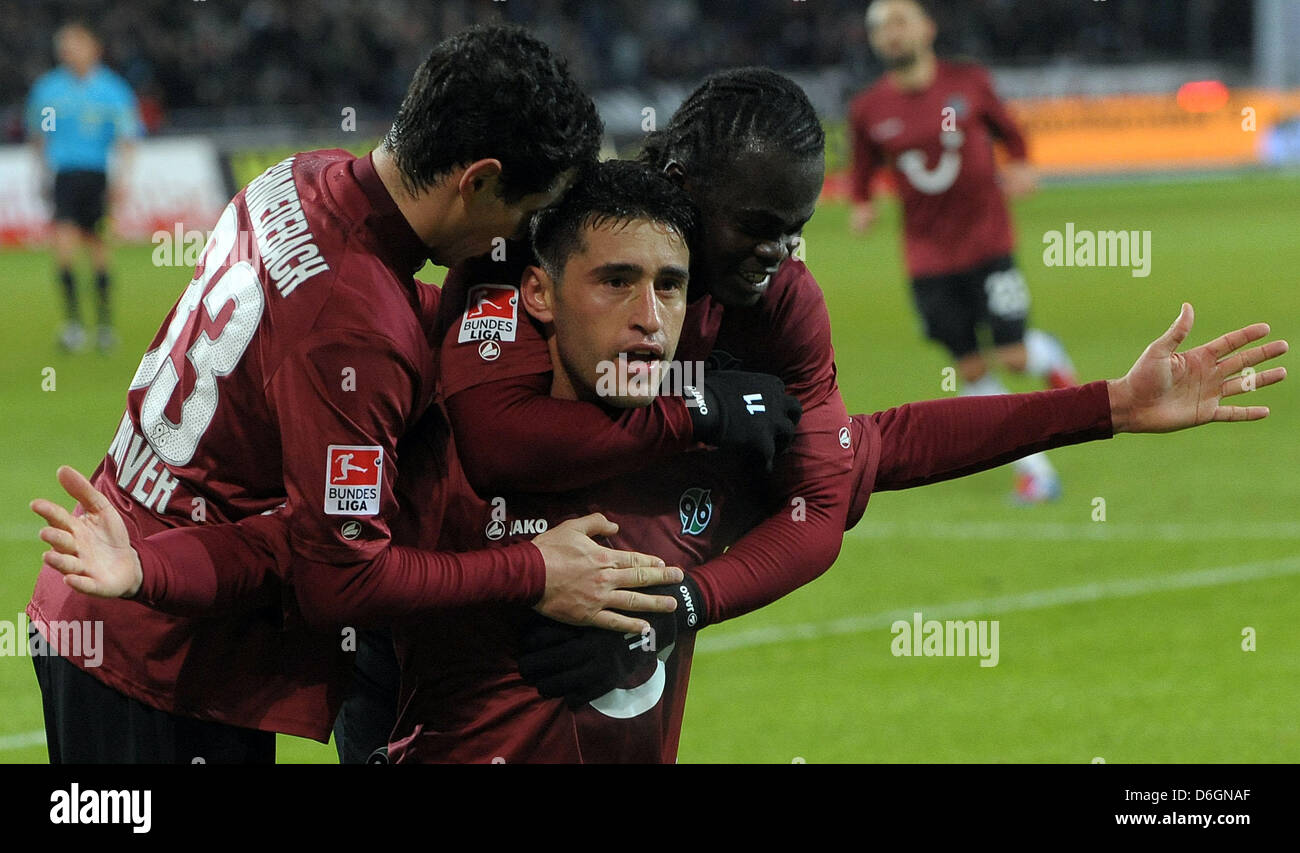 Hannover's Karim Haggui (C) celebrates his 1-0 goal with Manuel ...