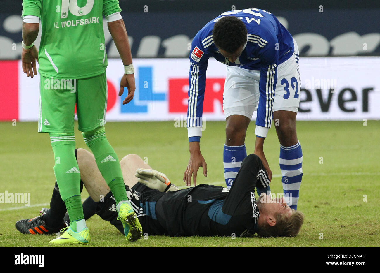 Schalke's Joel Matip bend forward to injured goalkeeper Lars Unnerstall ...