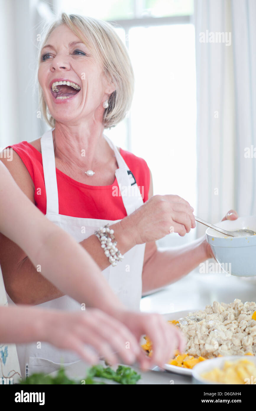 Women cooking together in kitchen Stock Photo - Alamy
