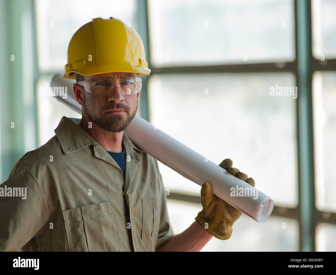 Engineer wearing hard hat on site Stock Photo - Alamy
