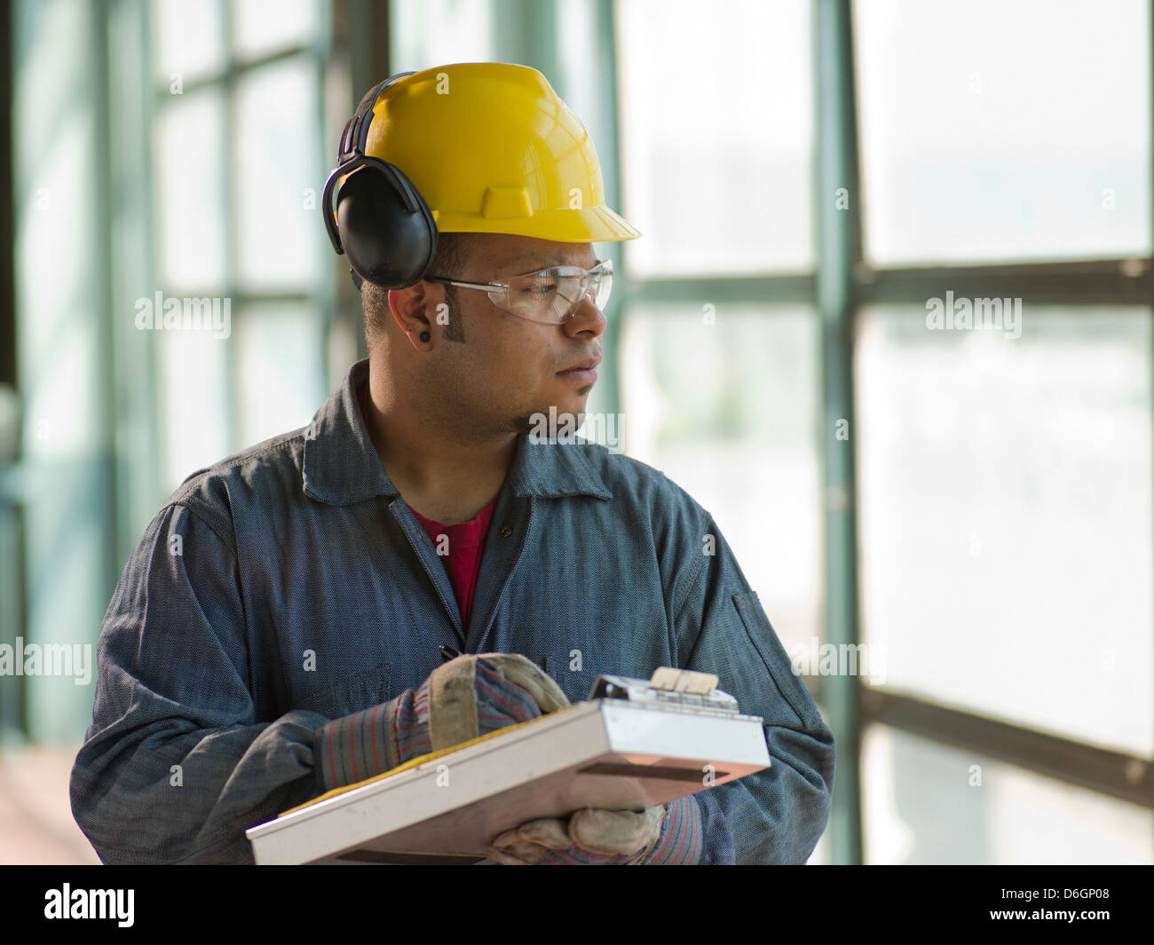 Engineer making notes on site Stock Photo - Alamy