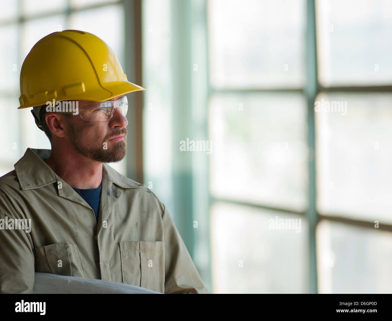 Engineer wearing hard hat on site Stock Photo - Alamy