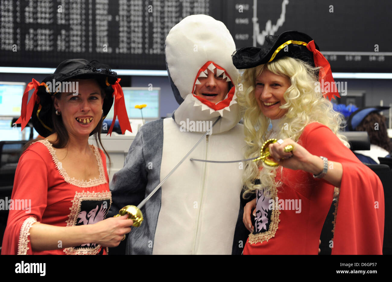 Stock brokers work in costume during carnival at the stock exchange in ...