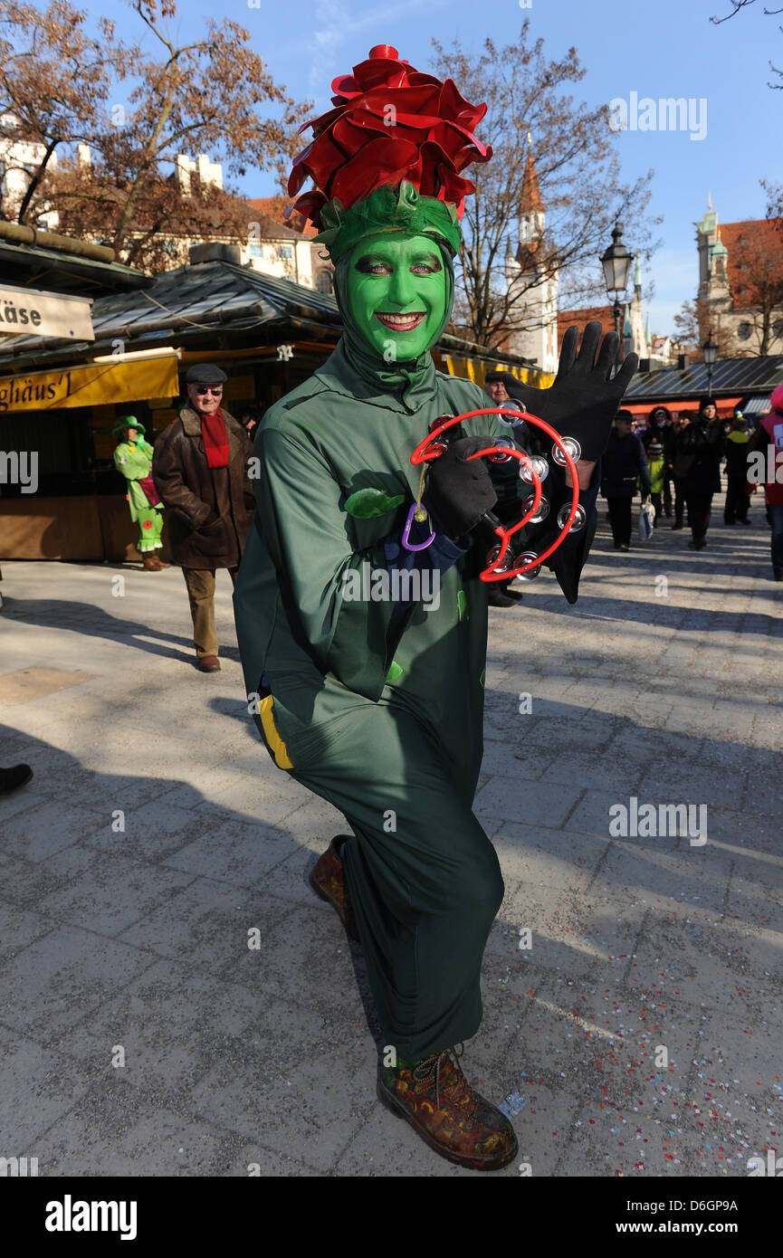 A man in costume participates in the carnival on the Viktualienmarkt in ...