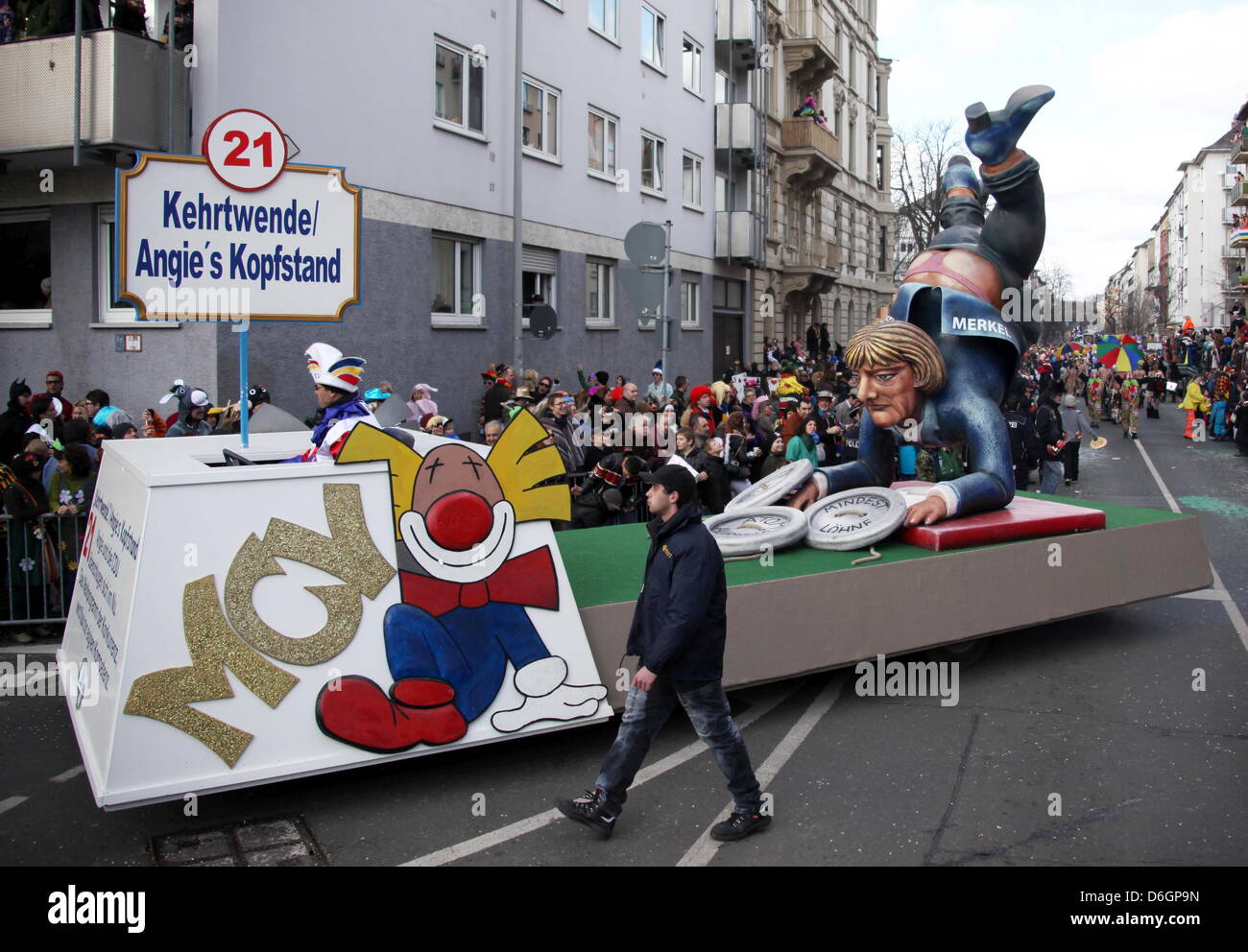 A parade wagon makes its way through the city on Carnival Monday in ...