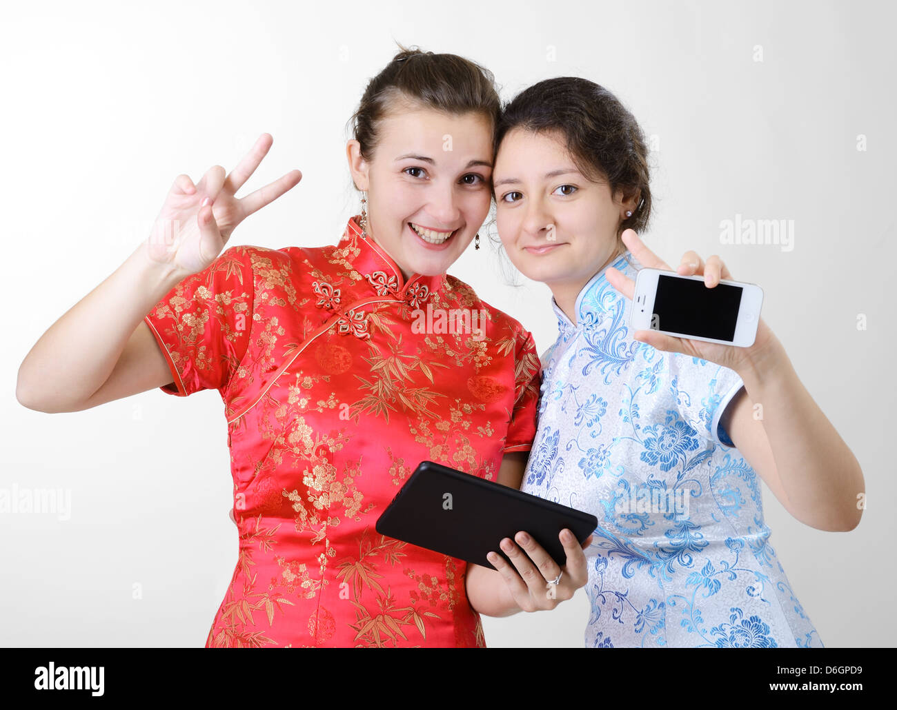 Happy women with mobile devices Stock Photo - Alamy