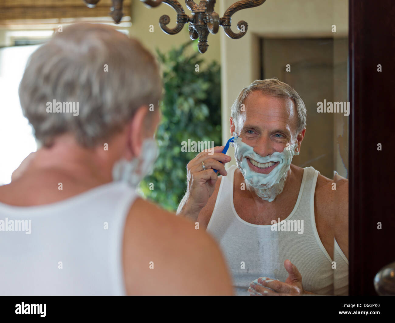 Man reflecting face in mirror hi-res stock photography and images - Alamy