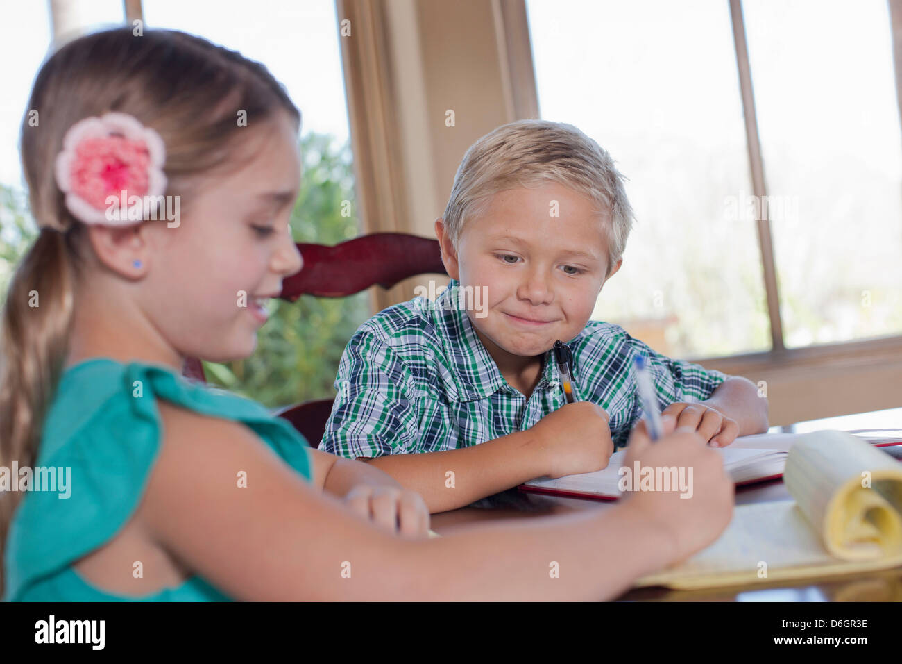 Children doing homework together Stock Photo - Alamy