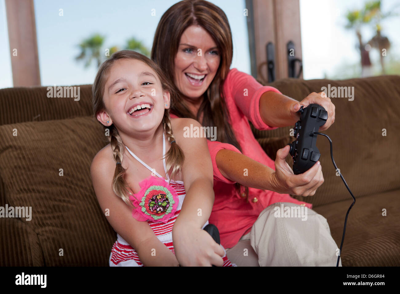 Mother and daughter playing video games Stock Photo - Alamy