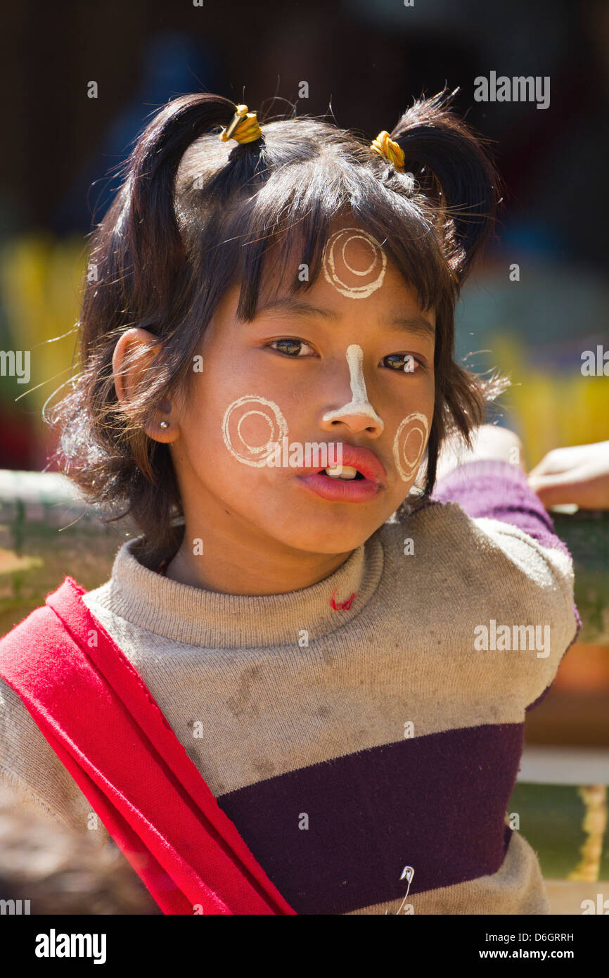 Cheeky little girl with Thanaka face decorations in Inn Thein Village ...