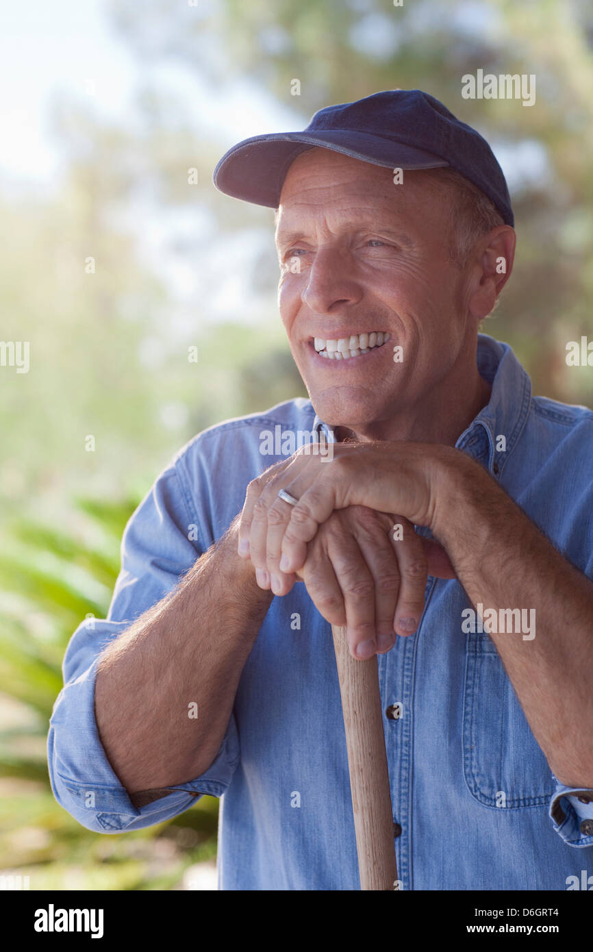 Older man gardening outdoors Stock Photo - Alamy