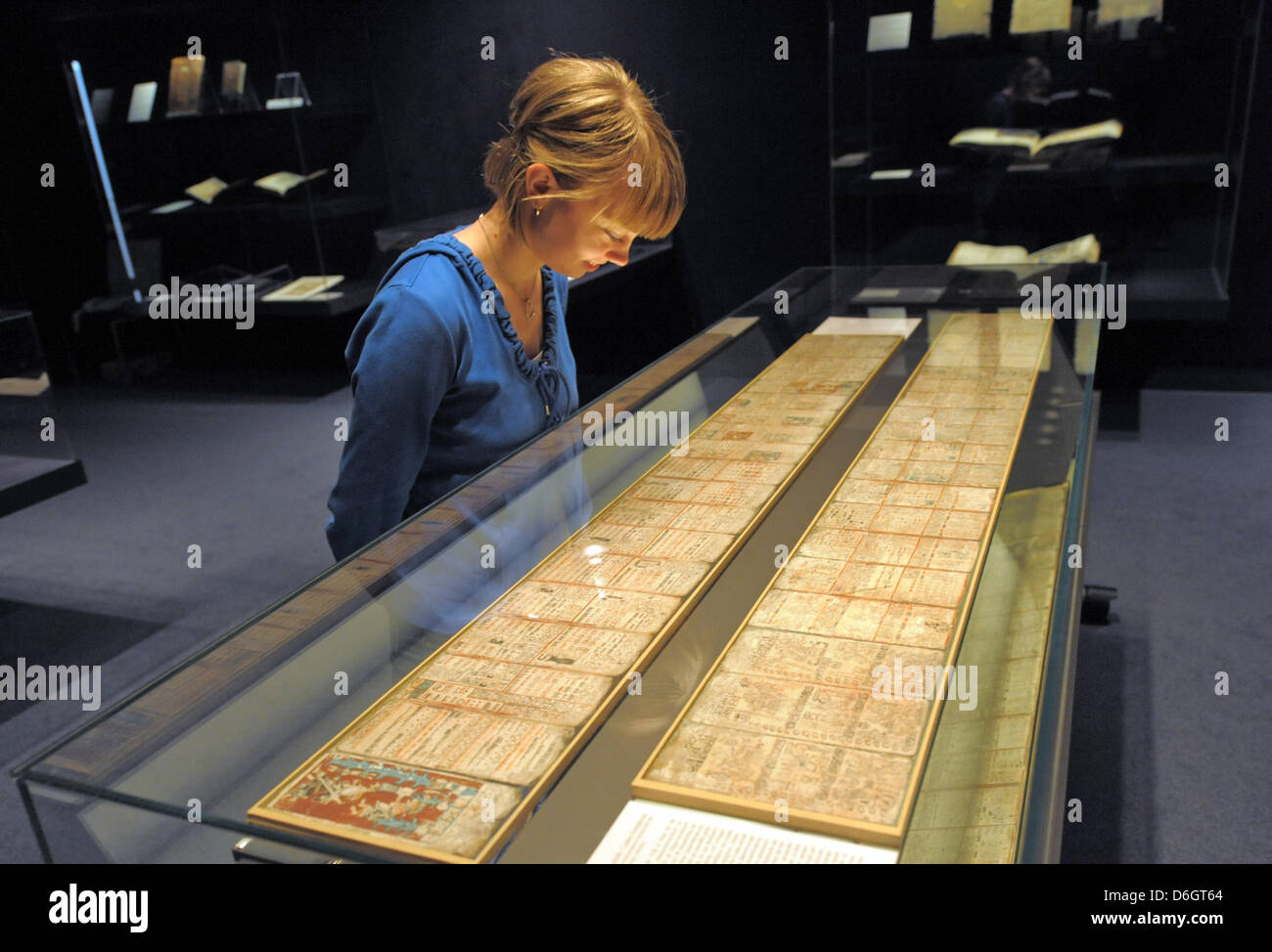 A visitor looks at the 800 year old Maya Codex which is on display at ...