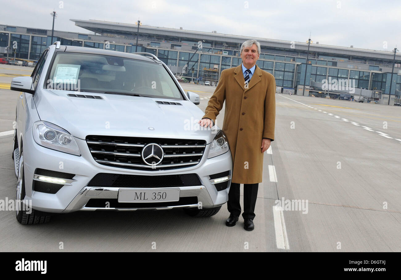 The head of Mercedes-Benz's Berlin branch office poses next to a ...