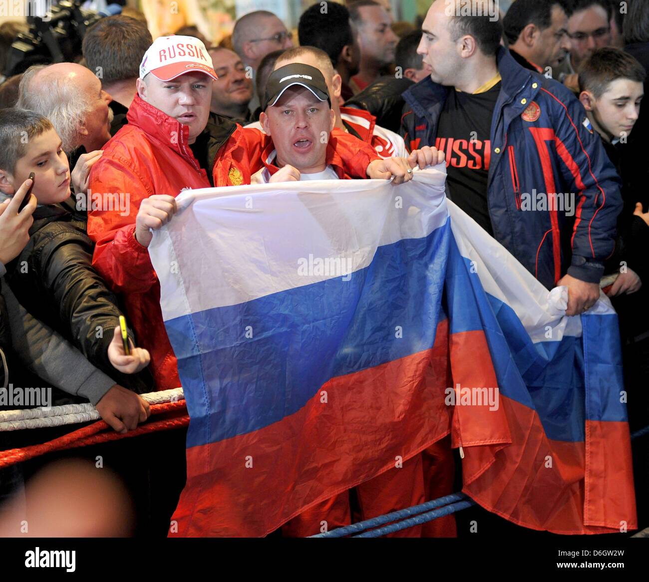 Fans of Russian heavyweight boxer Alexander Povetkin cheer during the ...