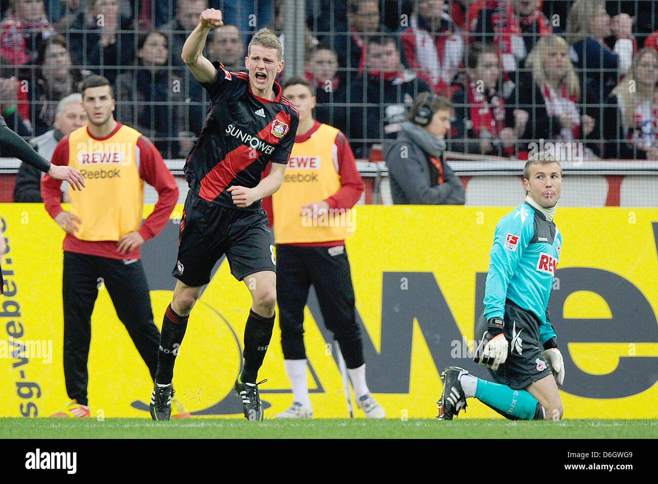 Leverkusen's Lars Bender (L) celebrates his 2-0 goal next to Koeln's ...