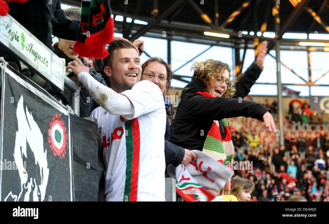 Augsburg's Daniel Baier celebrates the 3-0 victory with the fans after ...