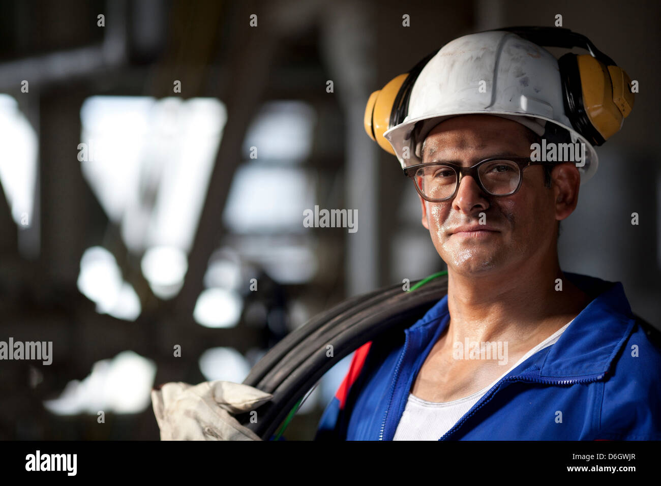 Industrial worker with wires in plant Stock Photo - Alamy