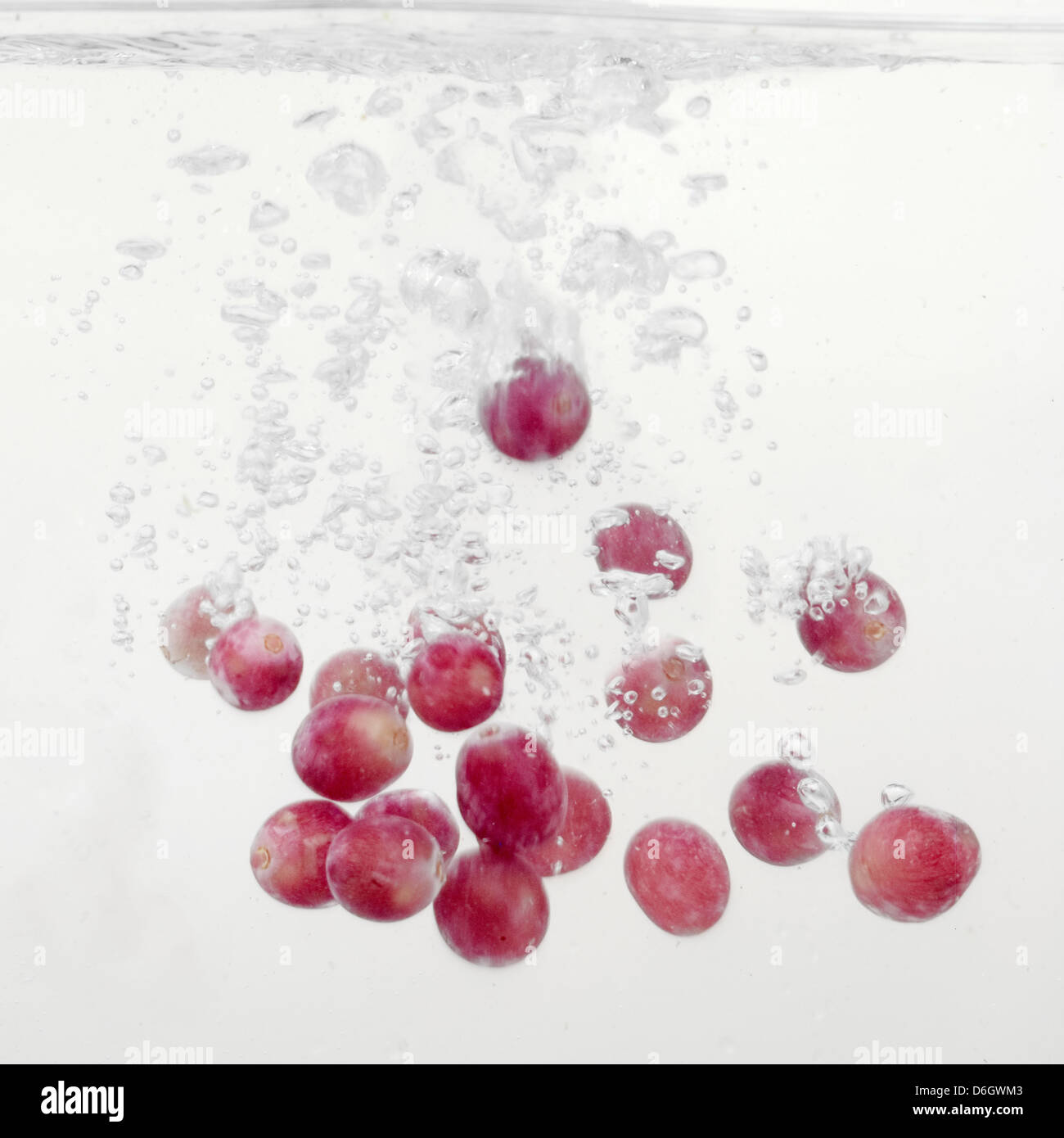 Red grapes splash Stock Photo - Alamy