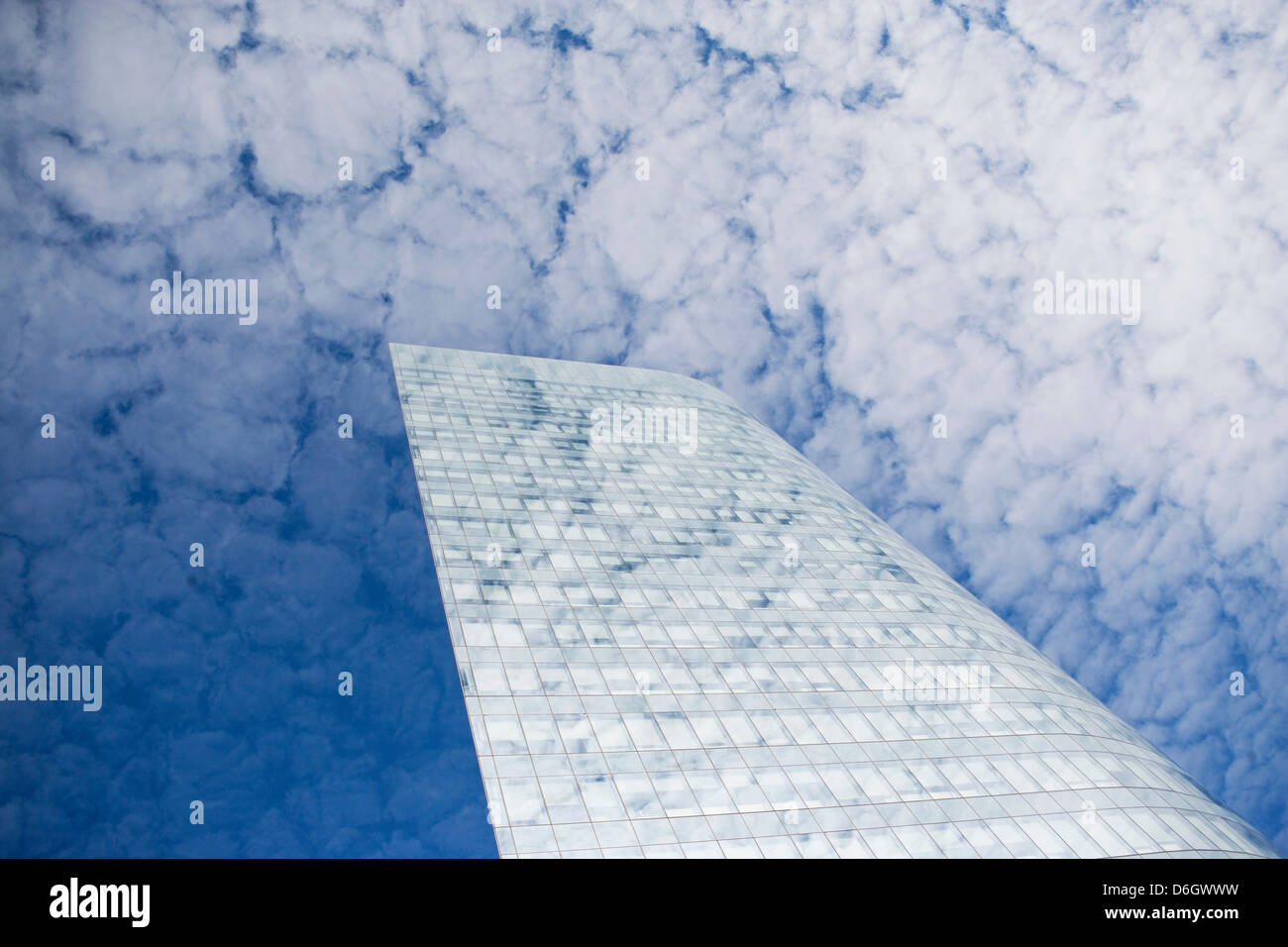 Glass skyscraper and cloudy sky Stock Photo - Alamy