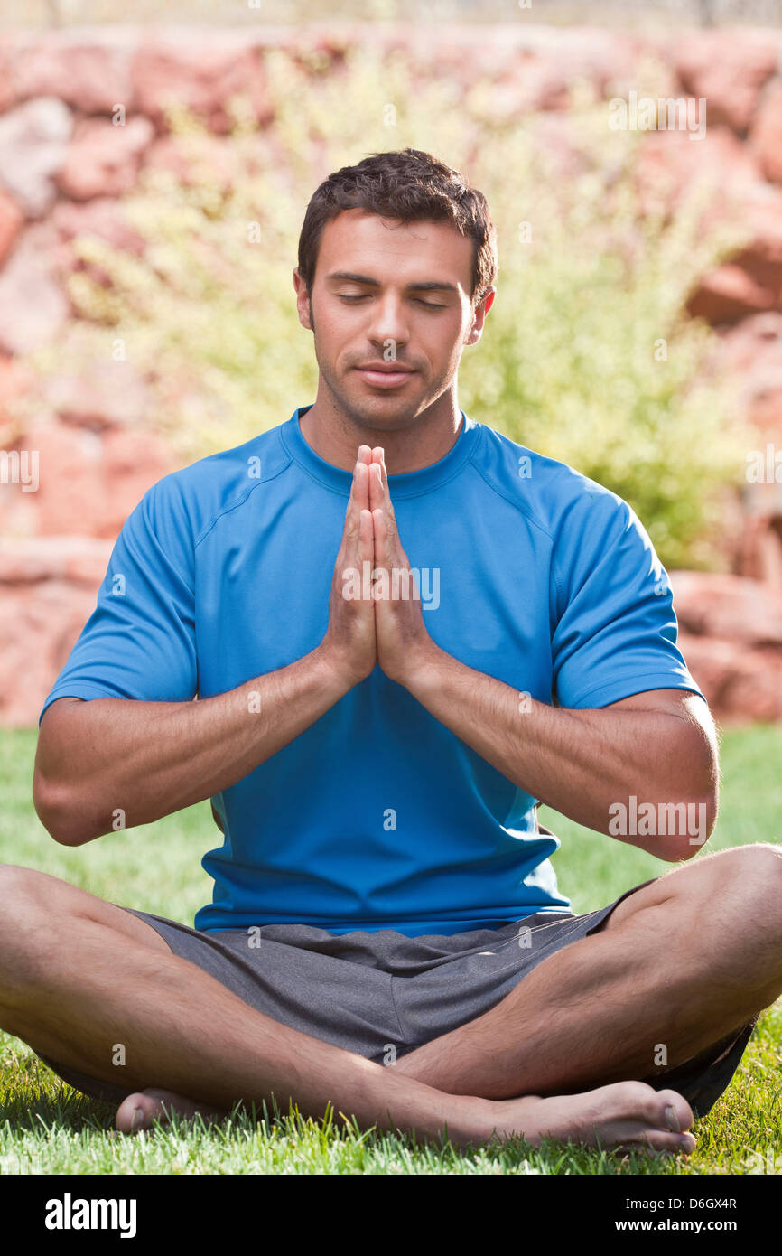 Man meditating outdoors Stock Photo - Alamy