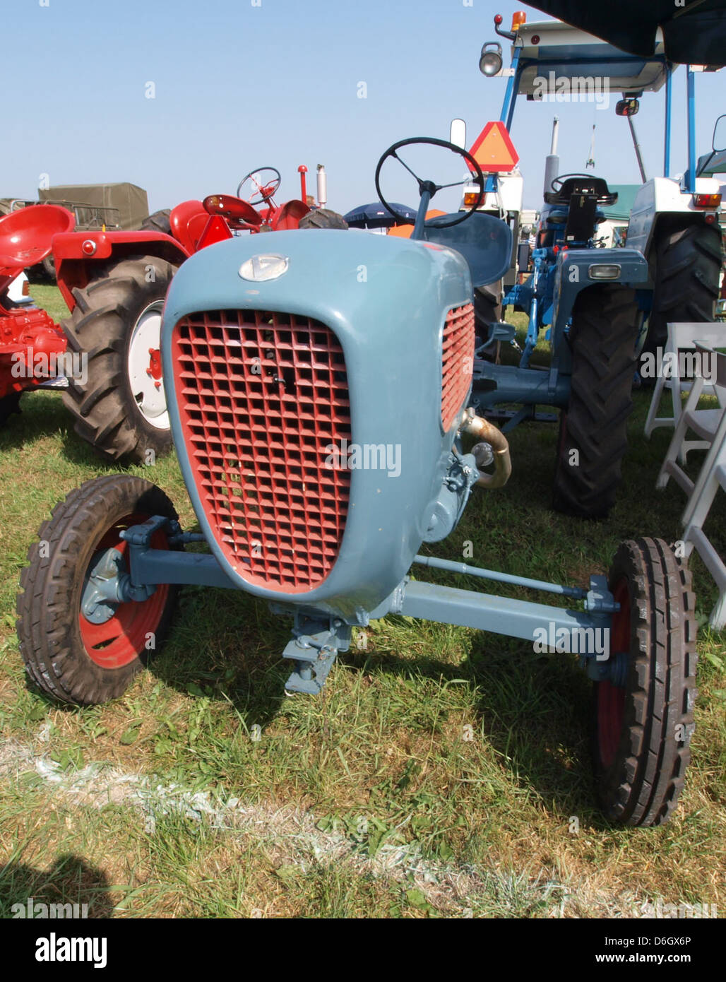 The Guldner tractor, painted blue with red wheels, is a classic example ...