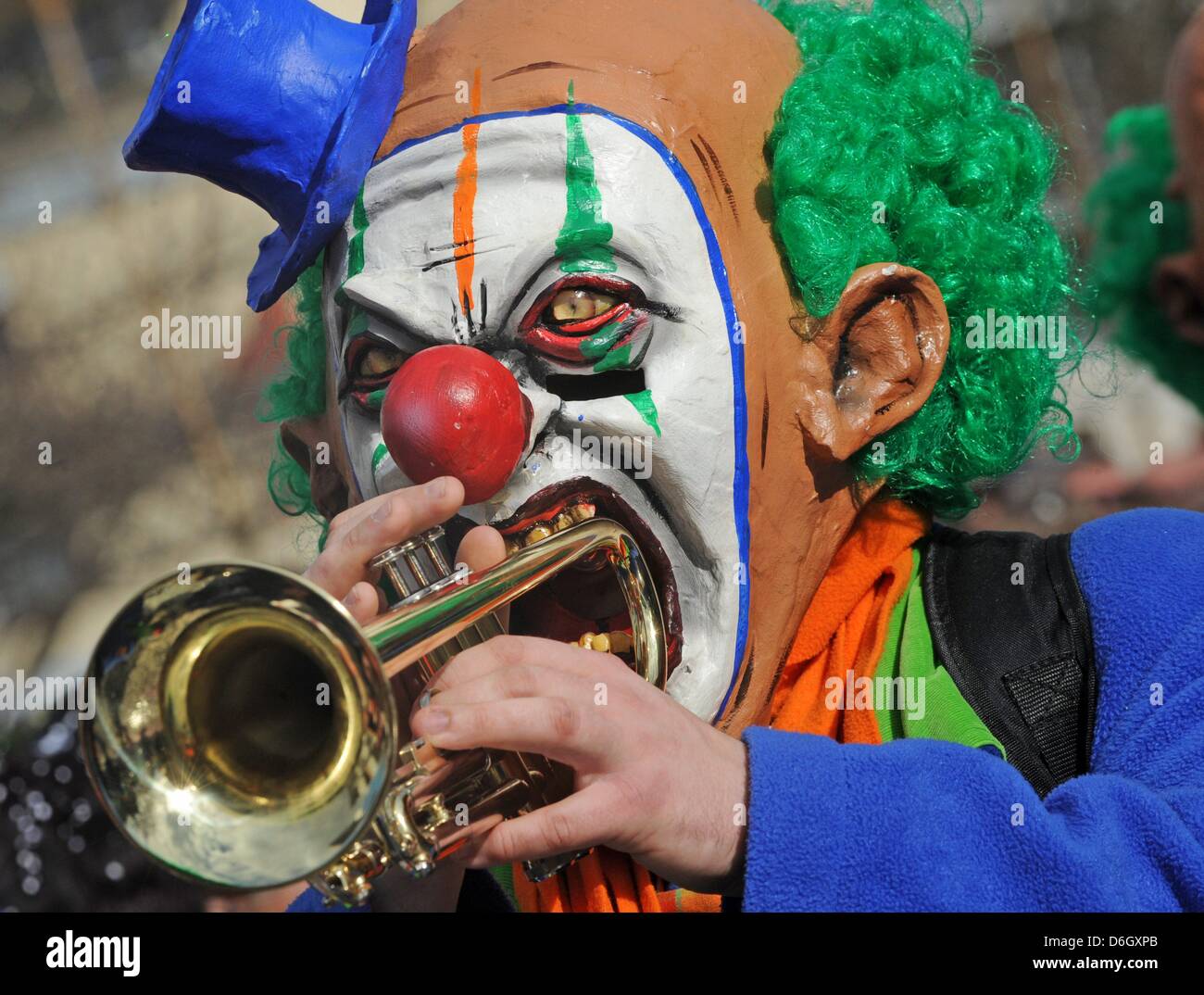 A man dressed as clown plays so-called Guggen music from Switzerland ...