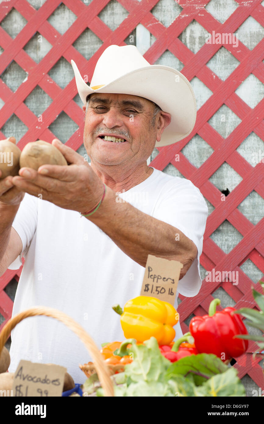 Man selling potatoes at farmer?s market Stock Photo - Alamy
