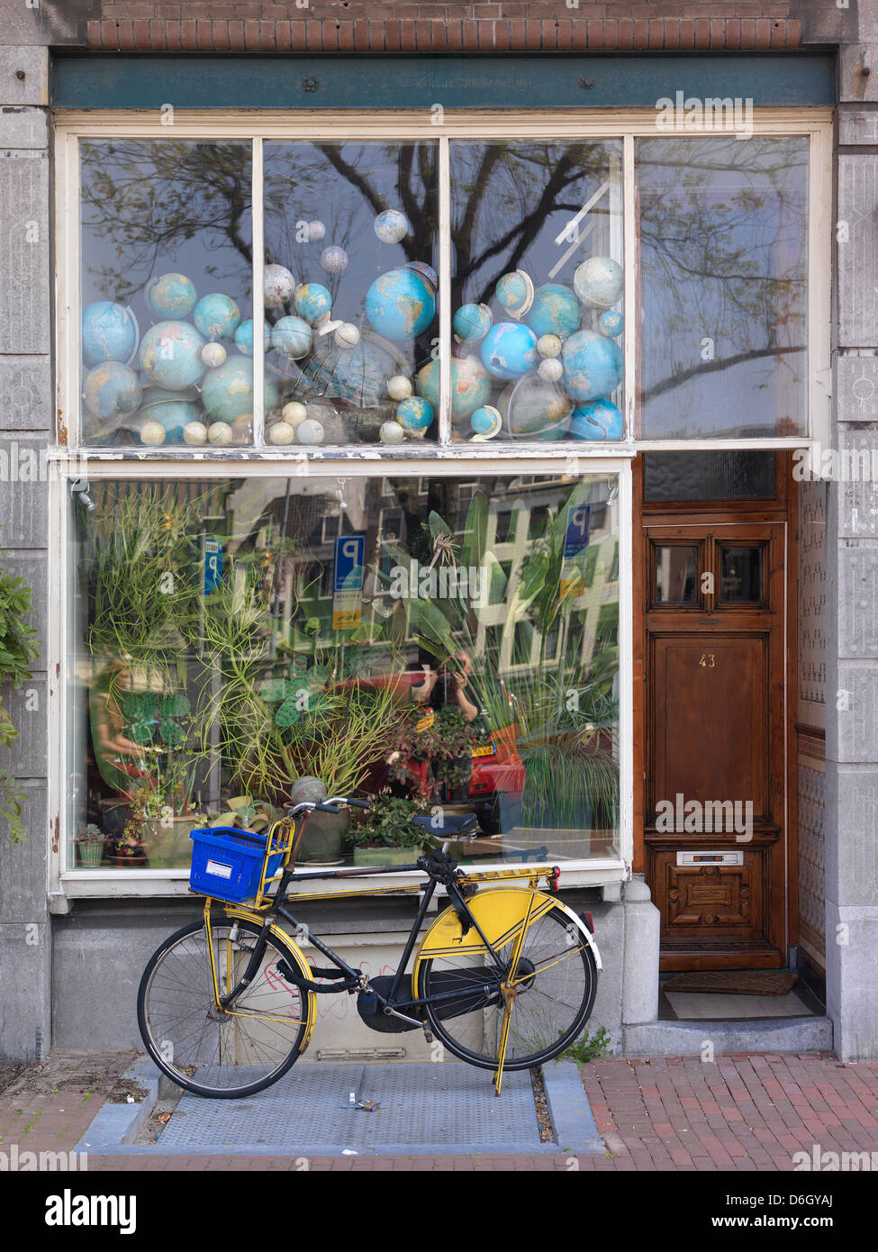 Amsterdam, The Netherlands, house facade with window Globes were full ...