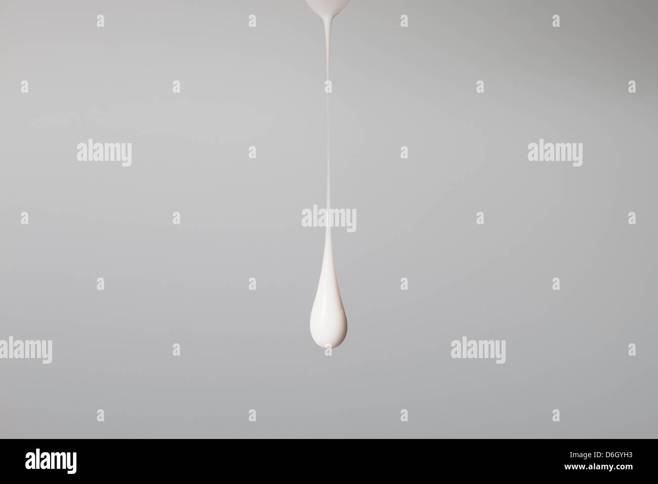 Drop of white paint Stock Photo - Alamy