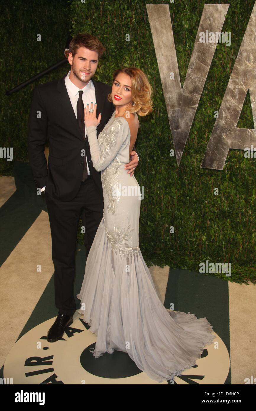 Actress Miley Cyrus and Liam Hemsworth attend the 2012 Vanity Fair ...