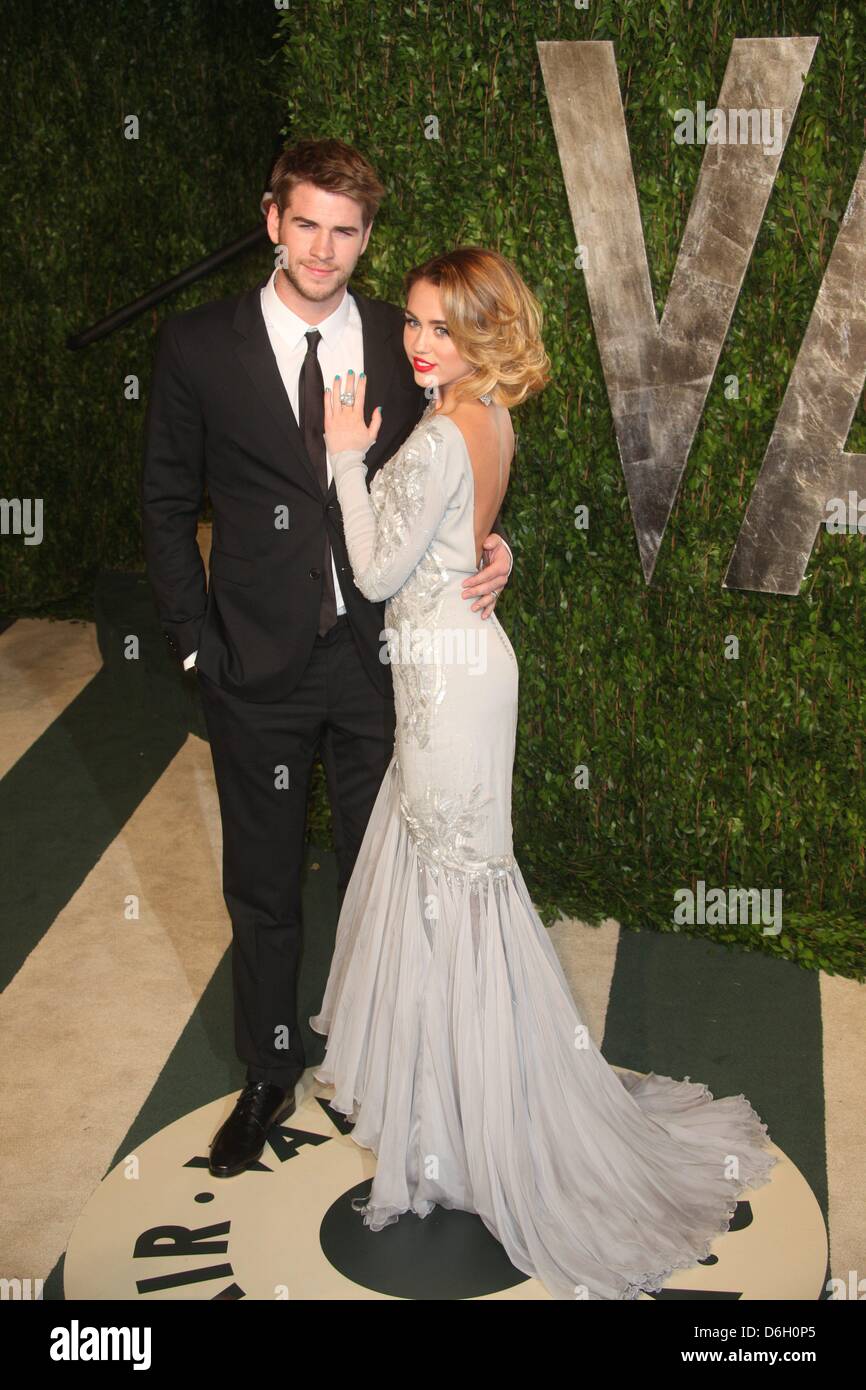 Actress Miley Cyrus and Liam Hemsworth attend the 2012 Vanity Fair ...