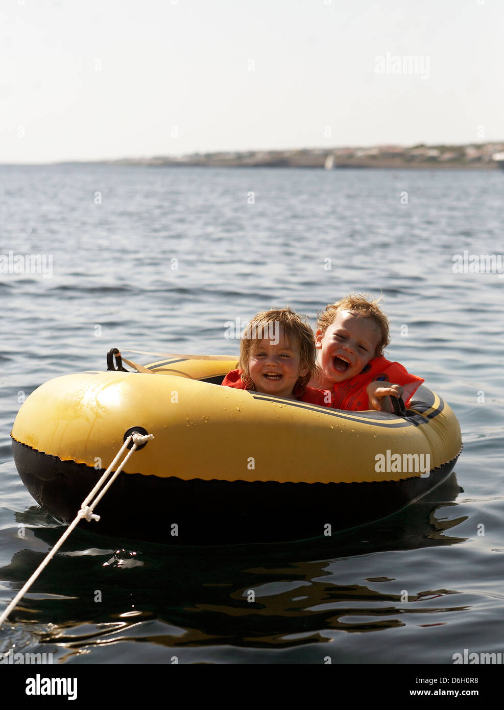 Children riding in inflatable boat Stock Photo - Alamy