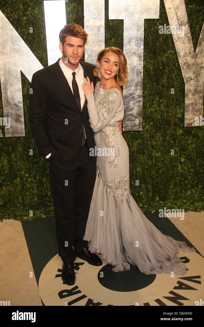 Actress Miley Cyrus and Liam Hemsworth attend the 2012 Vanity Fair ...