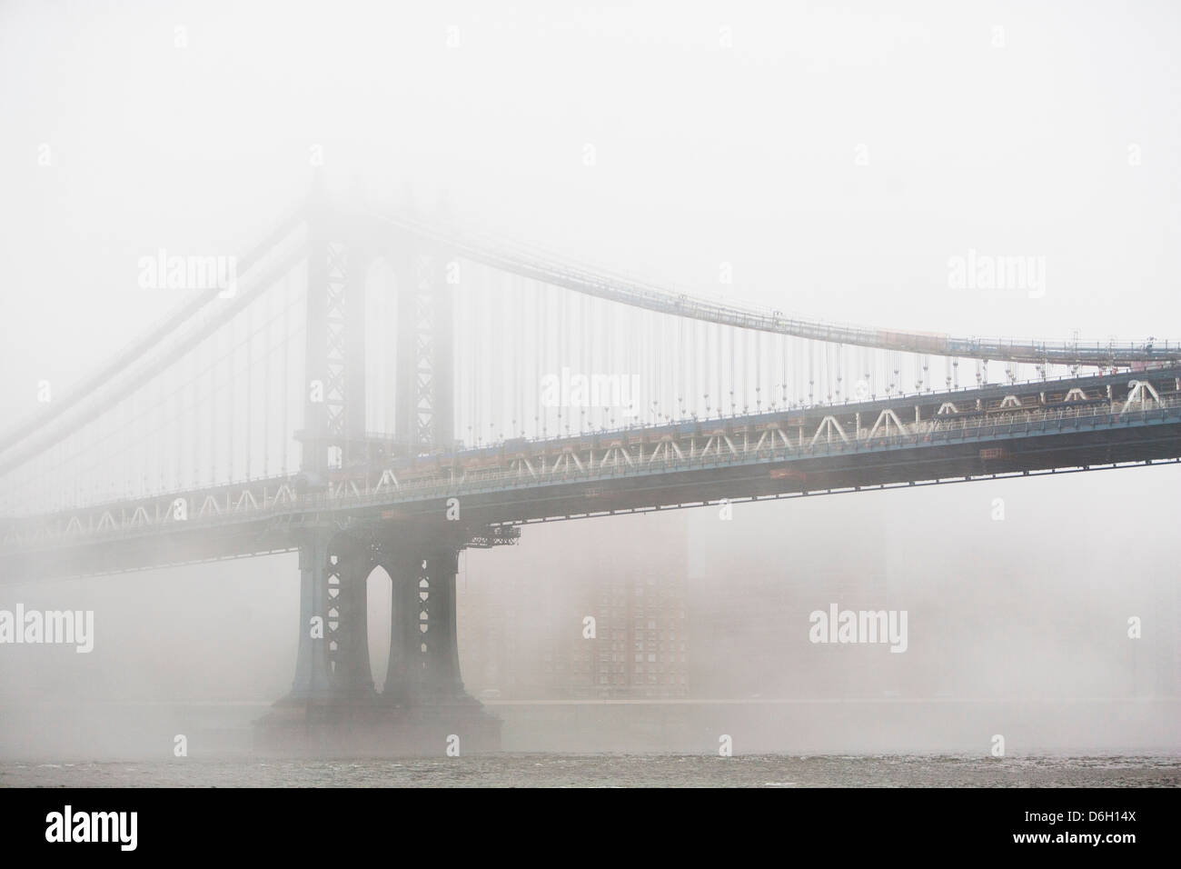Fog rolling over bridge Stock Photo - Alamy