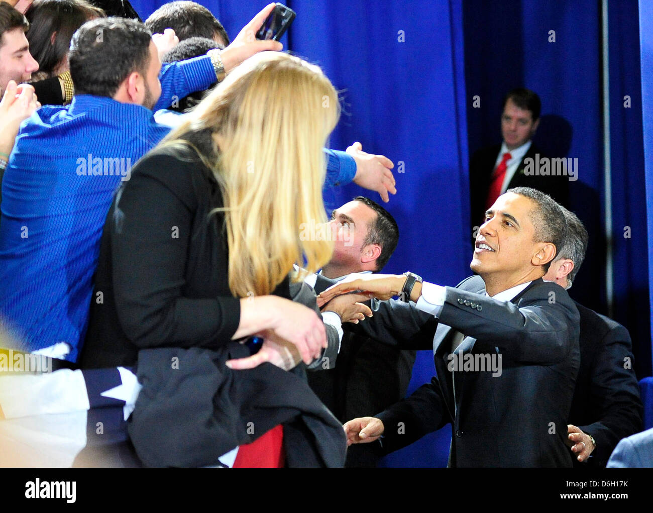 United States President Barack Obama shakes hands with students ...