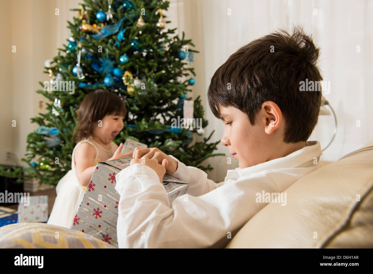 Children opening Christmas gifts Stock Photo - Alamy