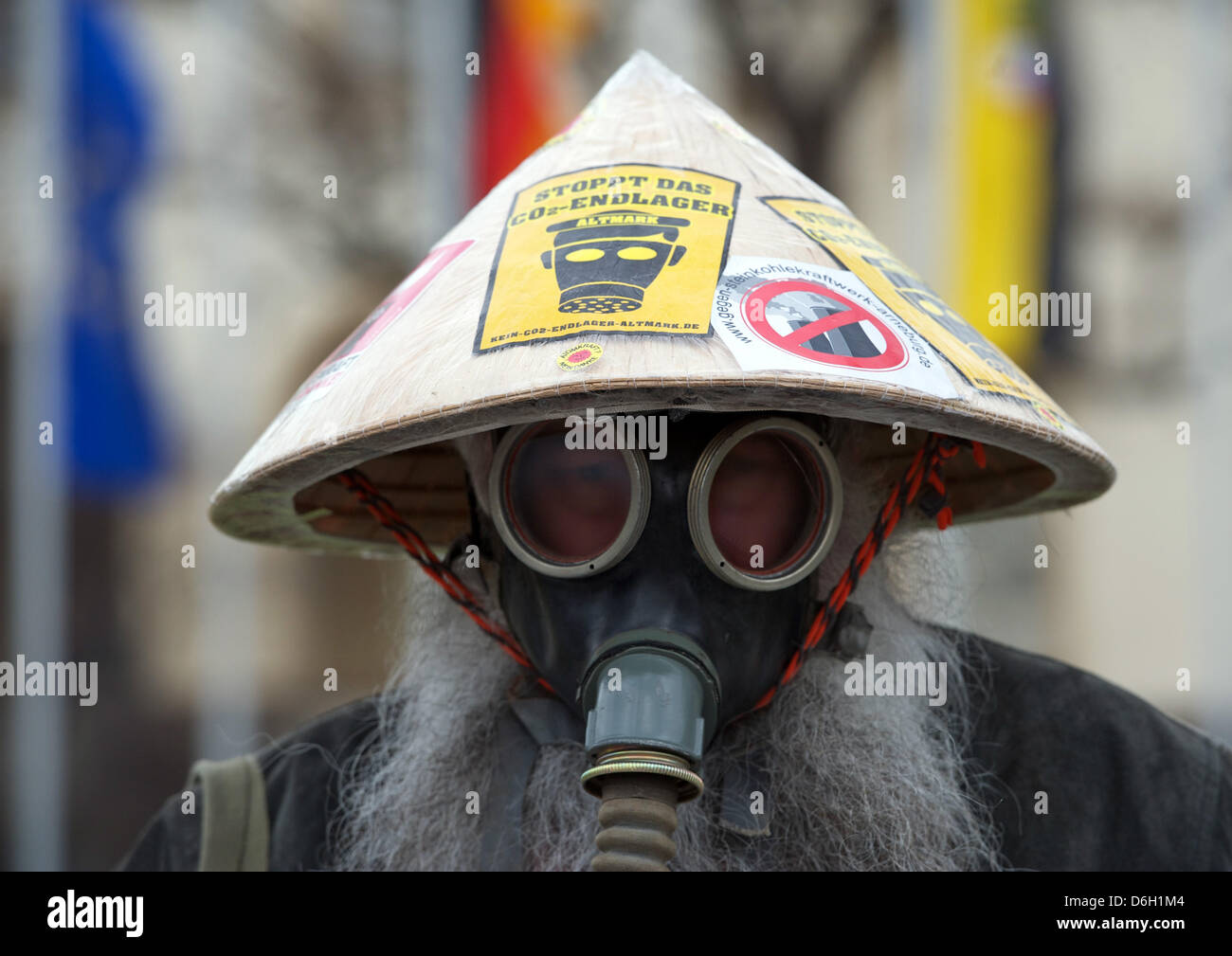A demonstrator wearing a gas mask protest during a summit on brown coal ...