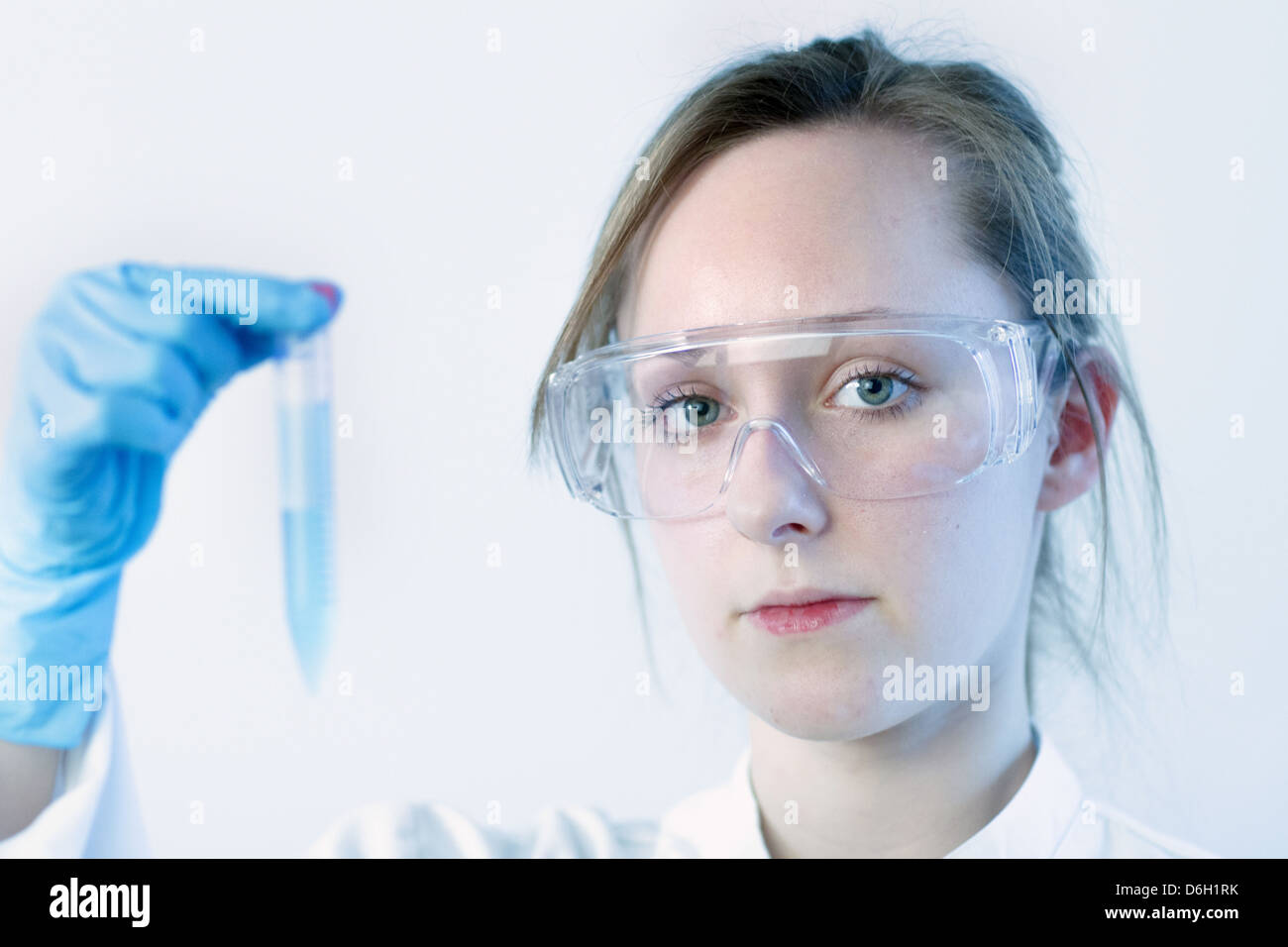 Scientist examining test tube in lab hi-res stock photography and ...