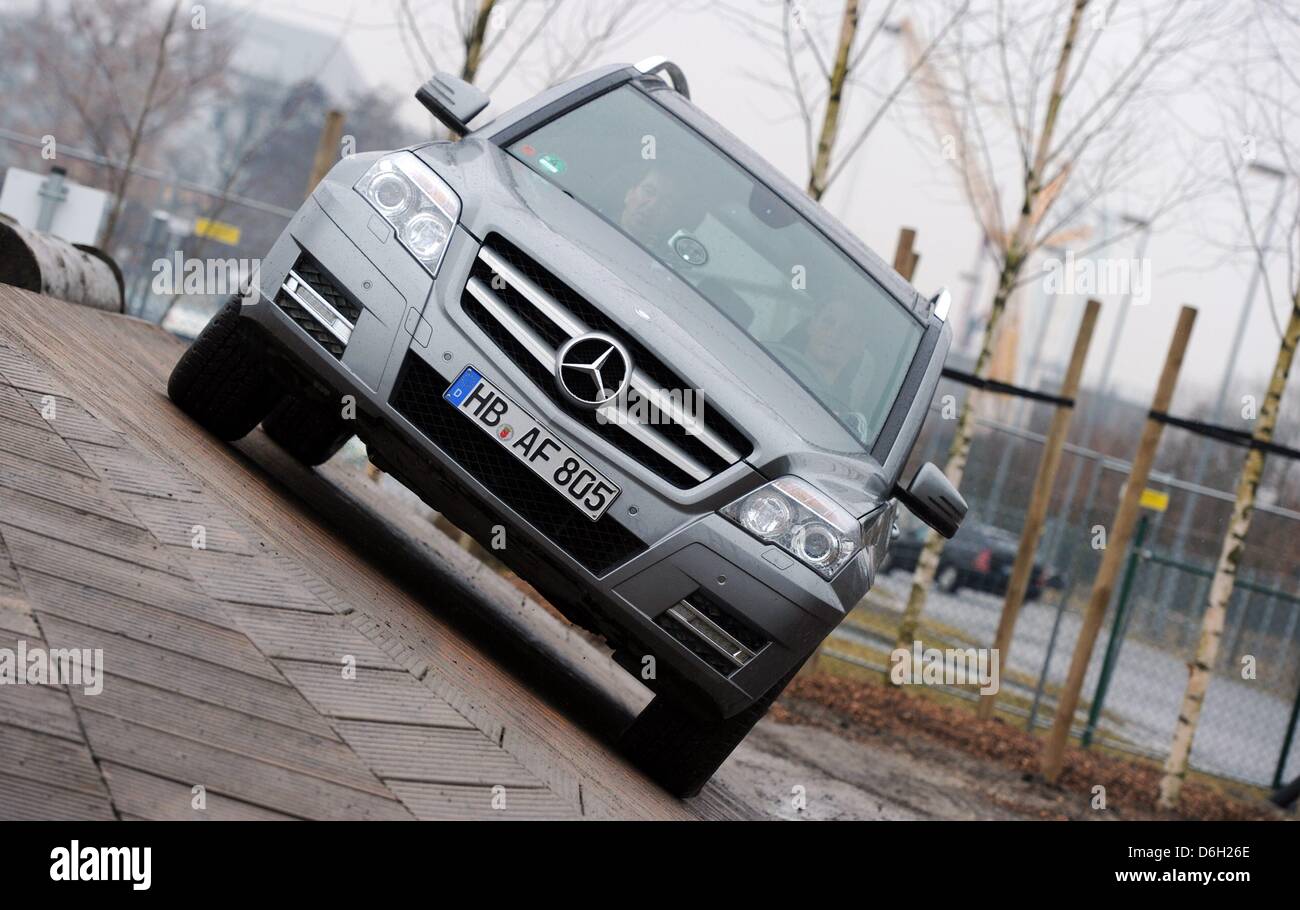 German national players drive along the Mercedes Benz Offroad-Parcours ...