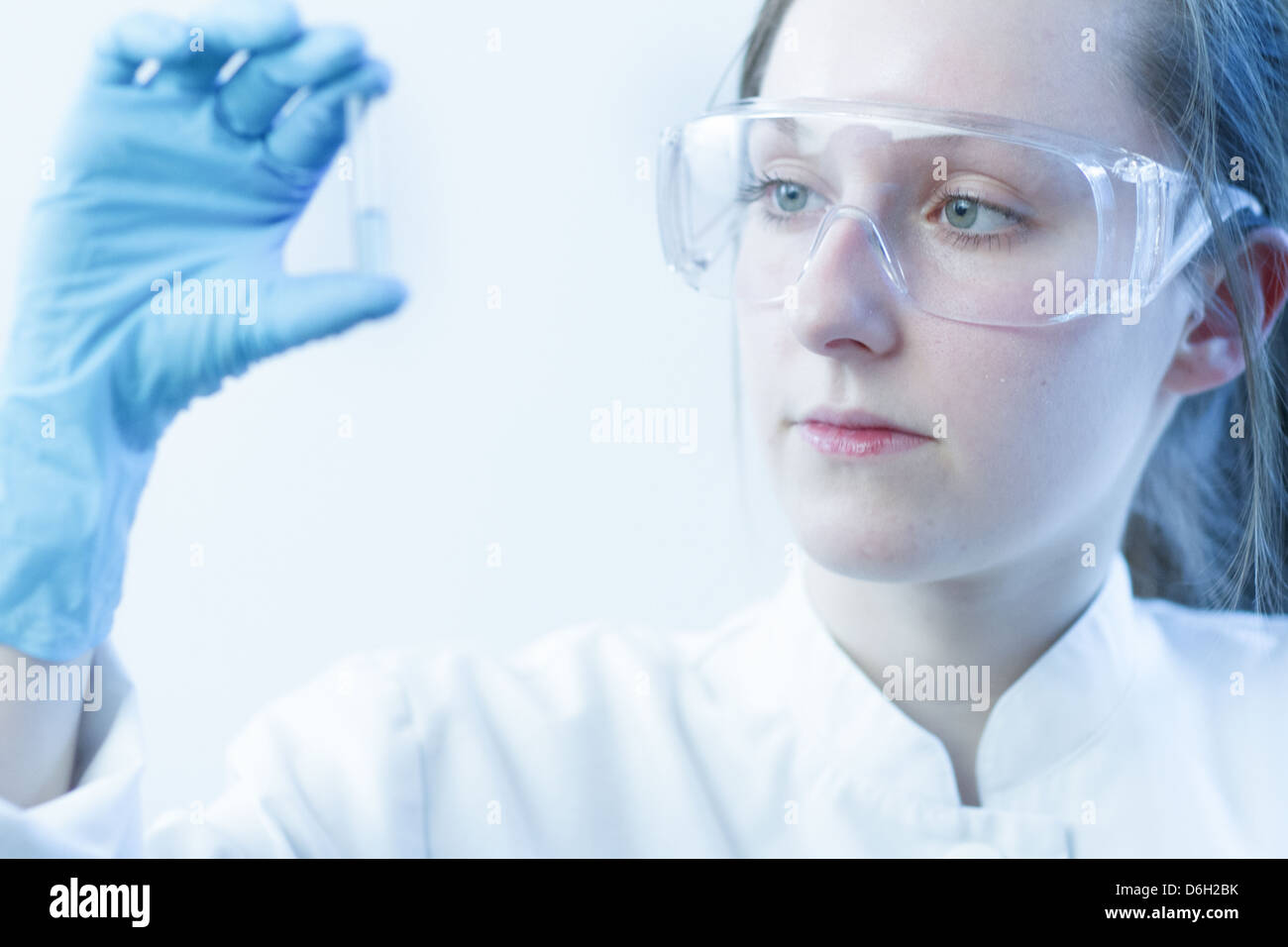 Scientist examining test tube in lab Stock Photo - Alamy